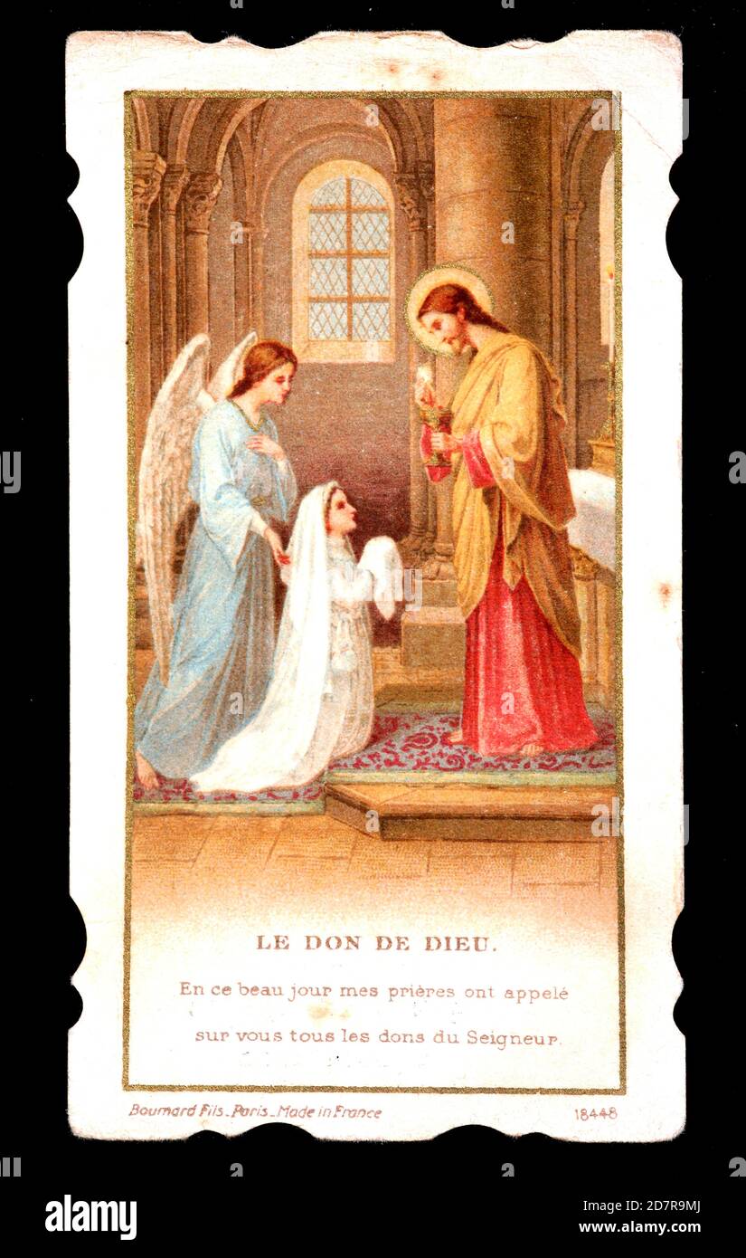 Old French card depicting a child receiving her first Communion Stock ...