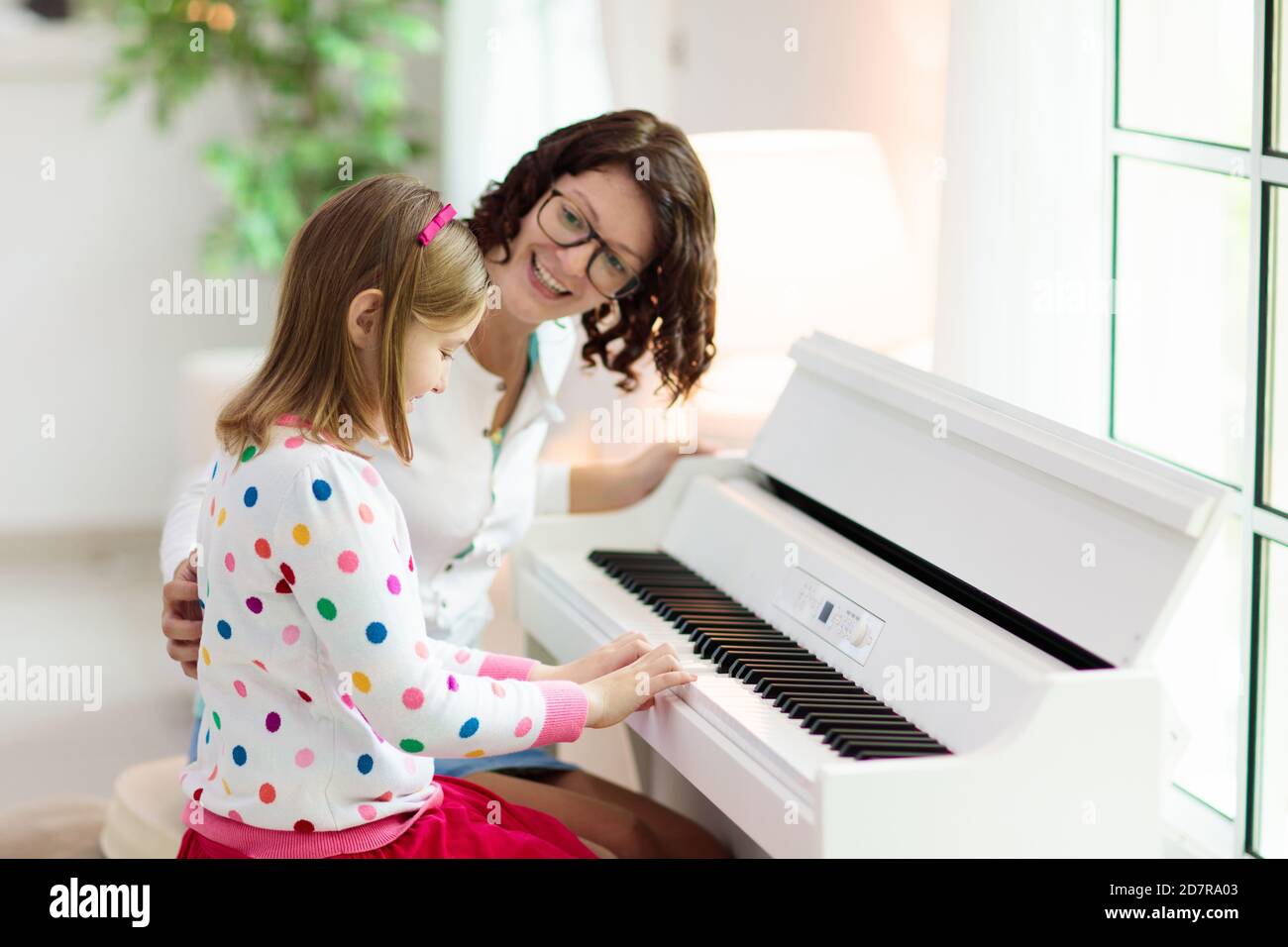 Child playing piano. Kids play music. Classical education for children ...