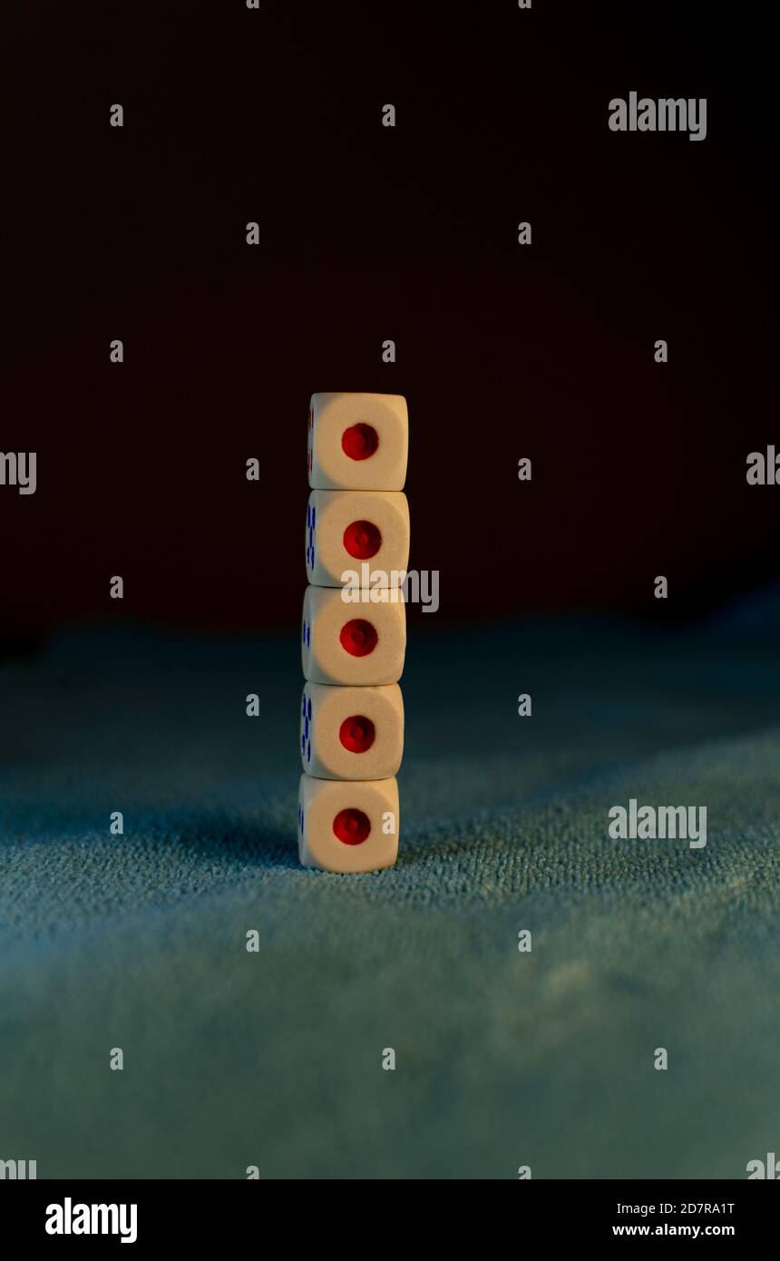Vertical shot of tower of five dice number one Stock Photo - Alamy