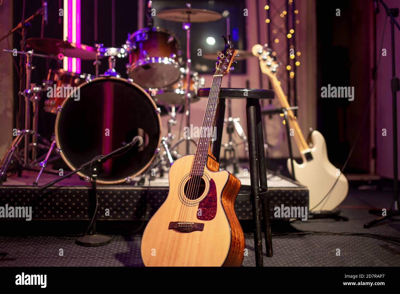Acoustic guitar on the background of a recording Studio. Room for ...
