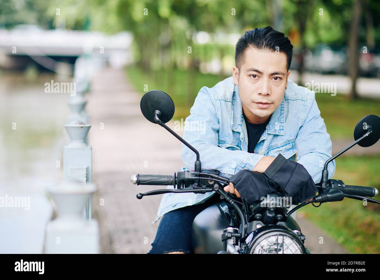 Serious handsome motorcyclist Stock Photo - Alamy