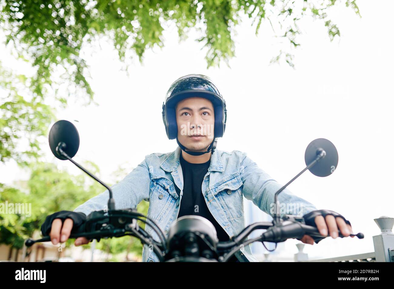 Motorcyclist riding fast Stock Photo - Alamy