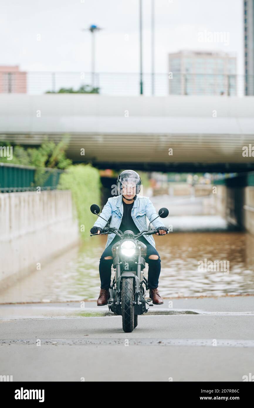 Man riding motorcycle on street hi-res stock photography and images - Alamy