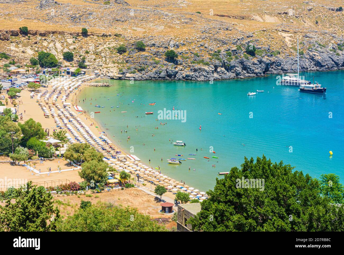 Popular Lindos Town beach, Lindos, Rhodes, Greece Stock Photo - Alamy