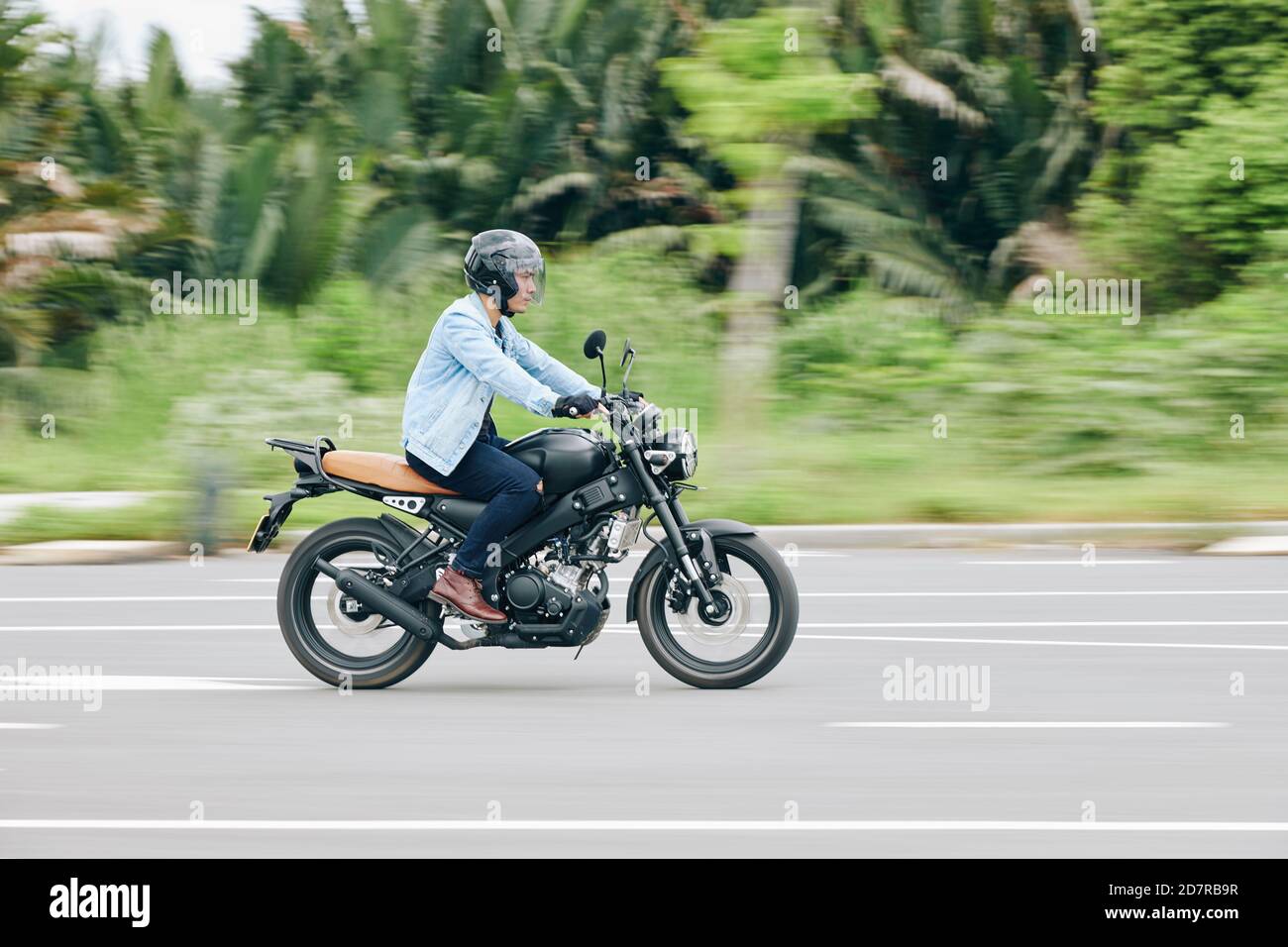 Riding fast on motorcycle Stock Photo - Alamy