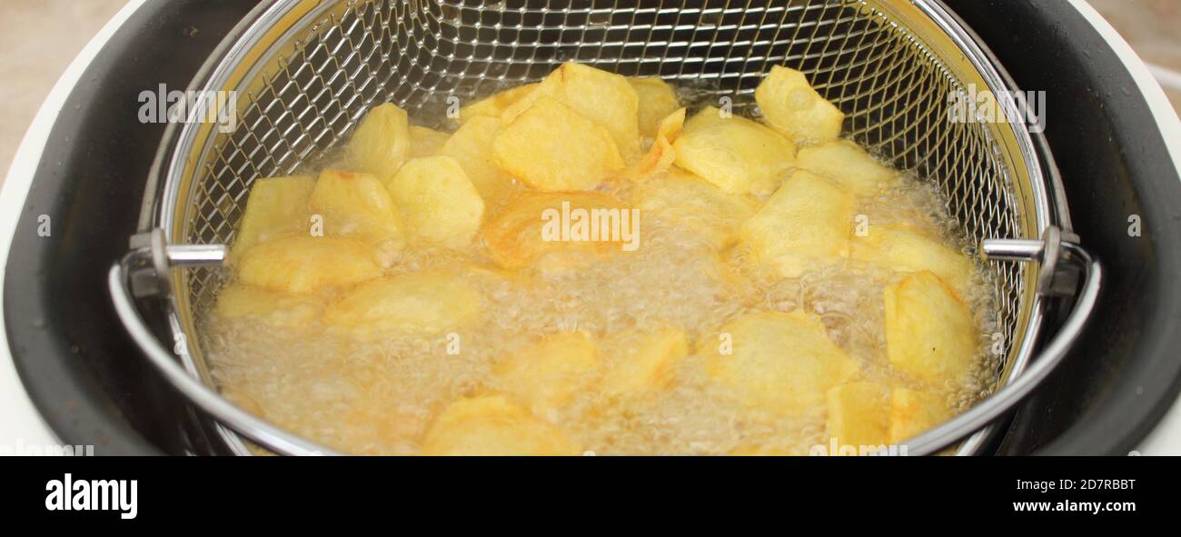 fresh crispy french fries from the deep fryer Stock Photo - Alamy