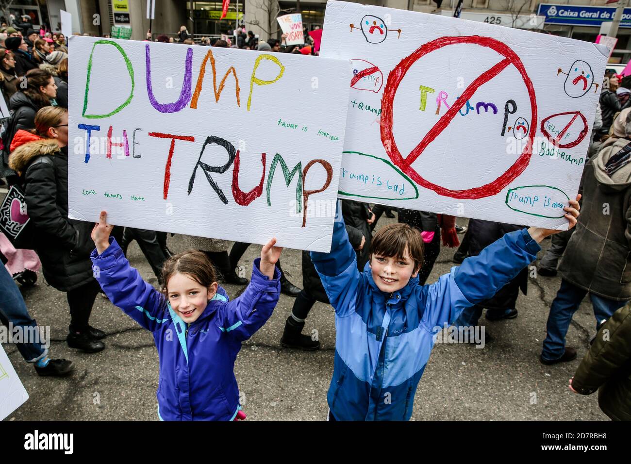 Two kids holding anti-Trump signs on placards during the demonstration ...