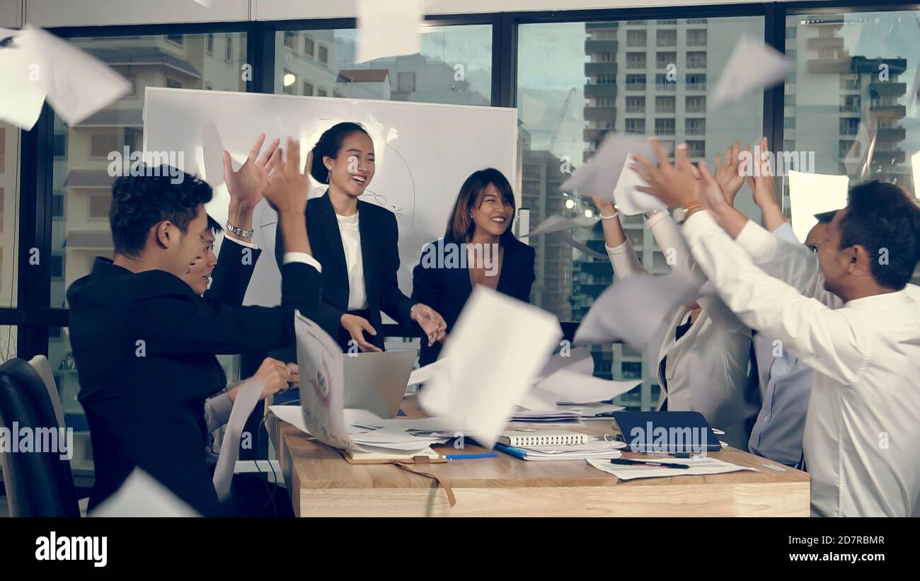 Successful Asian businessman and businesswoman celebrate project ...
