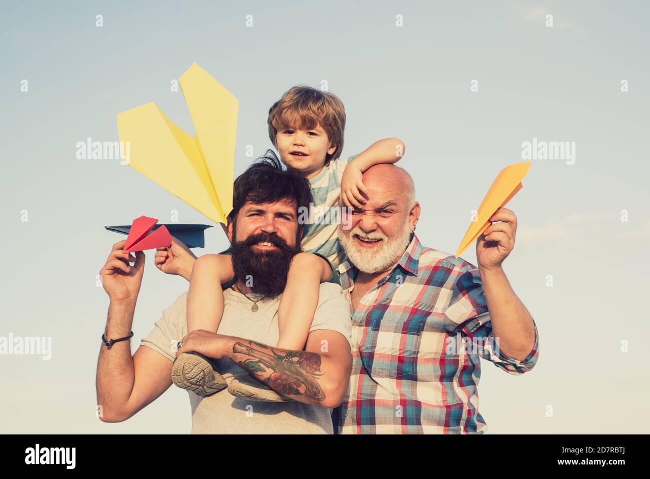 Fathers day - grandfather, father and son are hugging and having fun ...