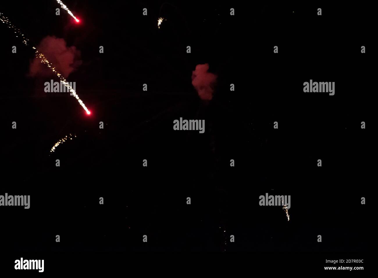 Golden rare stripes of fireworks with smoke and bokeh on a black ...