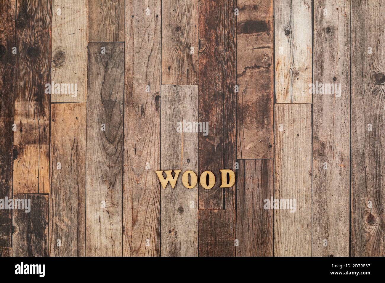 Wood word written in wooden alphabet letters on wooden background. Text ...