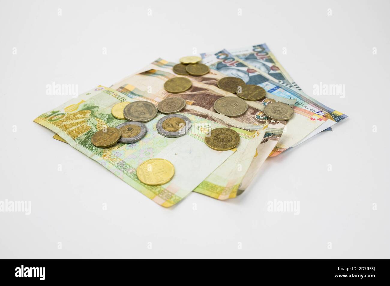 Peruvian sol banknotes and coins on the white background Stock Photo ...