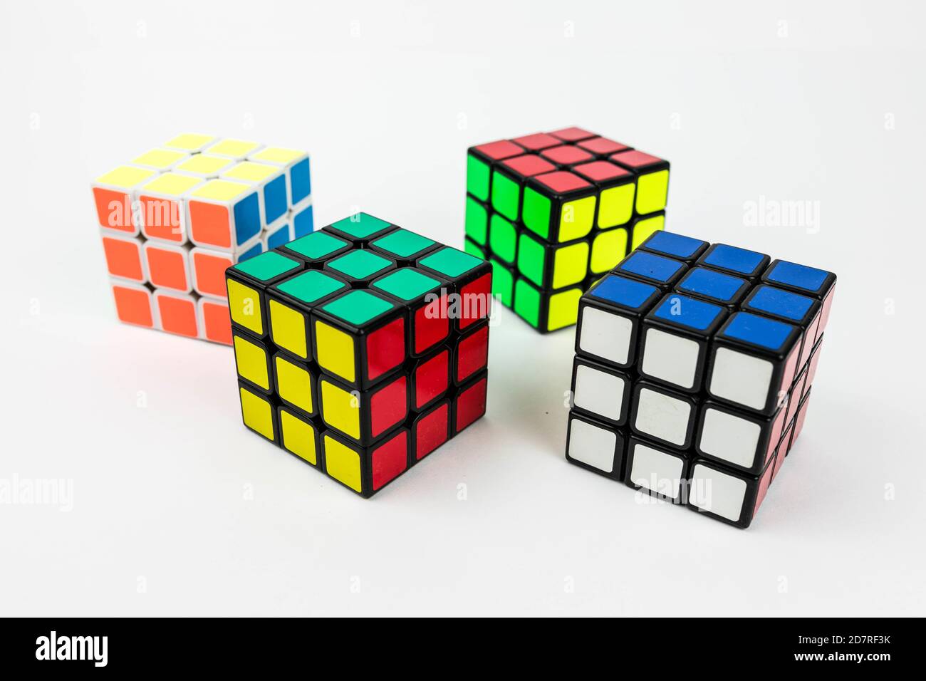 Colorful Rubik's cubes over white background Stock Photo - Alamy