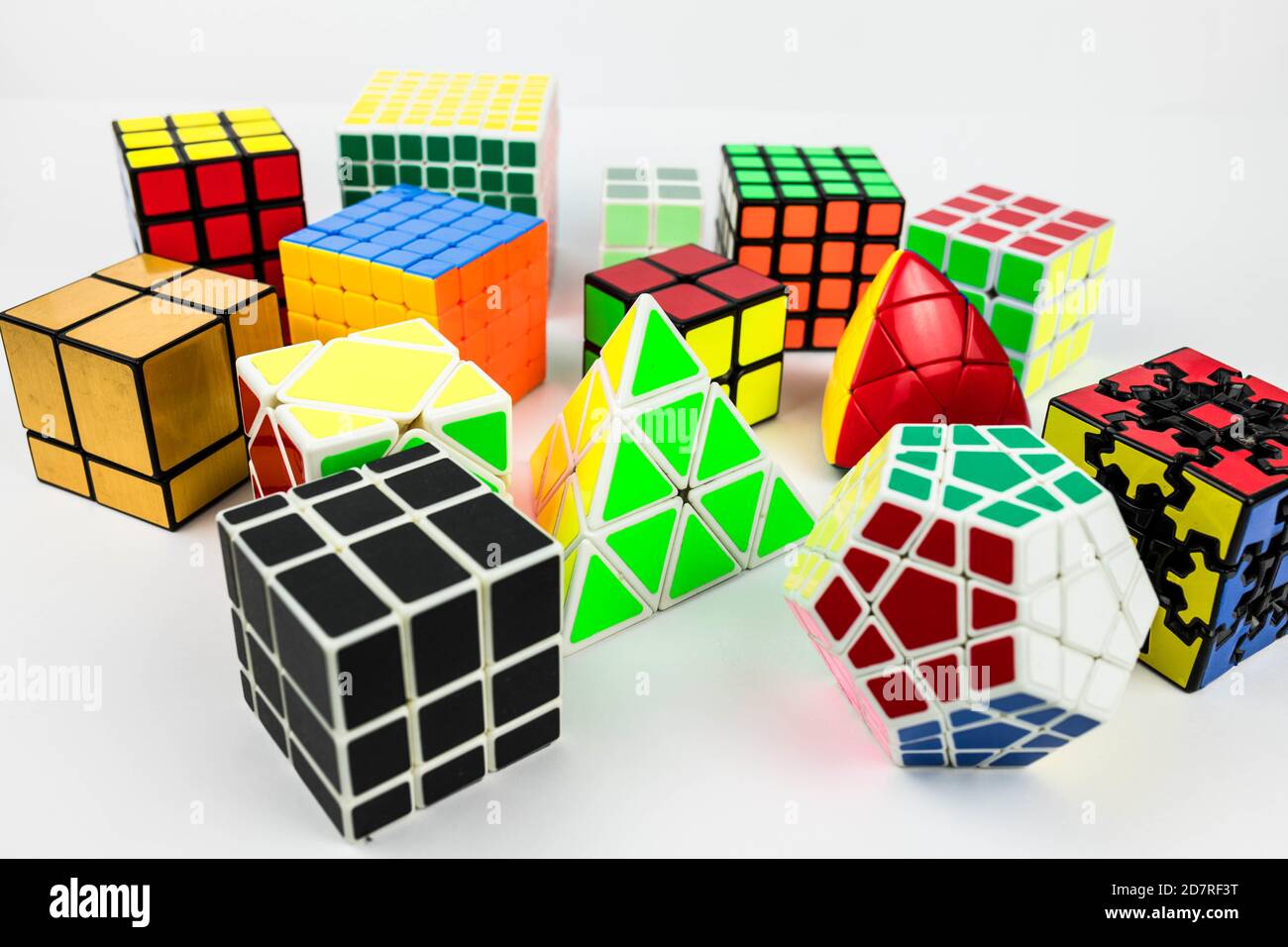 Colorful Rubik's cubes over white background Stock Photo - Alamy