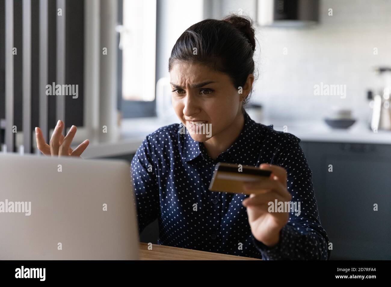 Unhappy Indian woman stressed with gadget problems shopping online ...