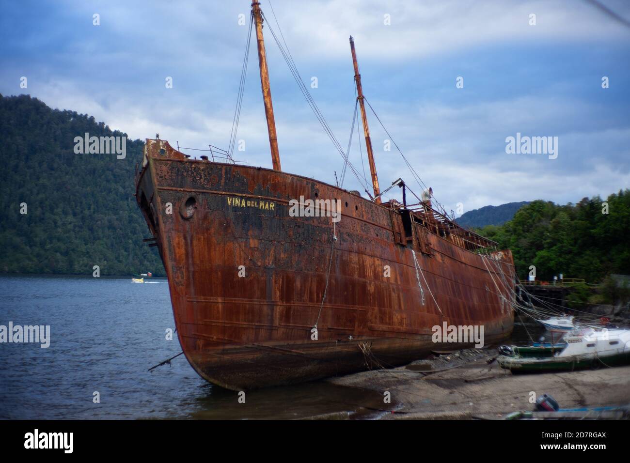 Large red abandoned corroded ship at the coast Stock Photo - Alamy