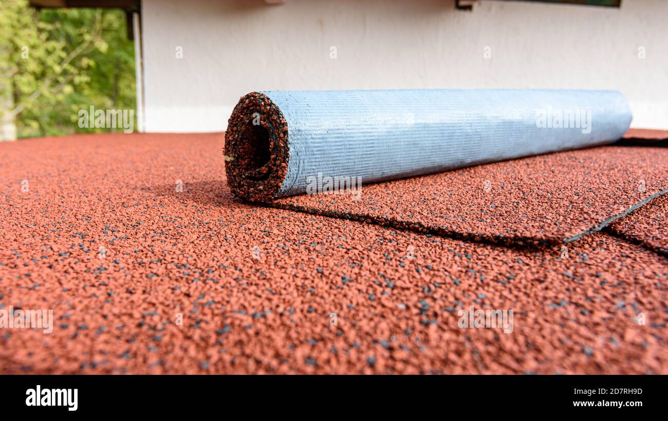Roofing material - flexible roll bitumen shingles Stock Photo - Alamy