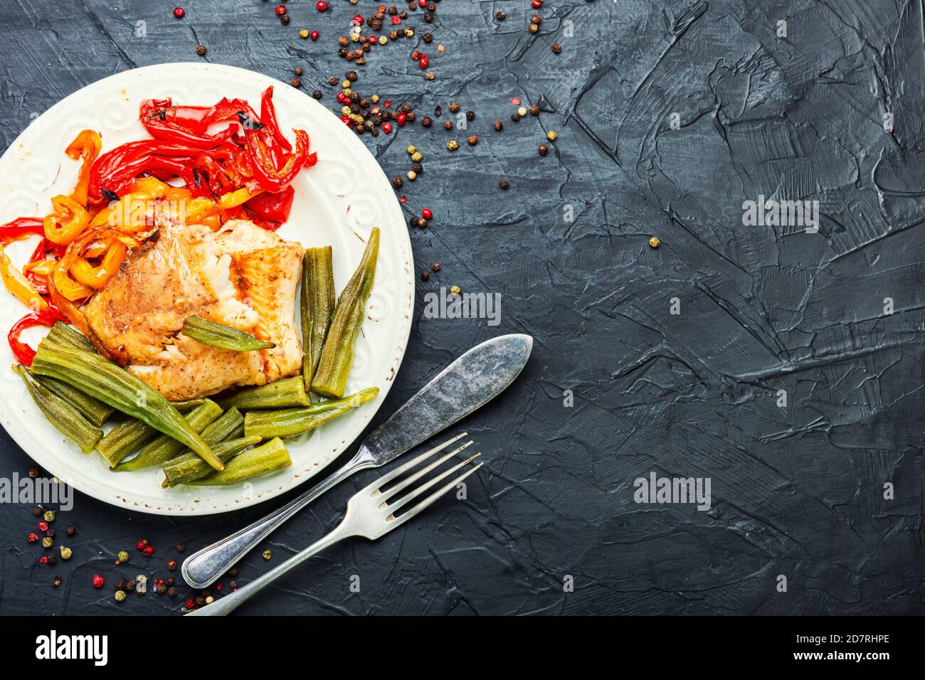 Fish grenadier baked with vegetables.Flat lay with copy space Stock ...