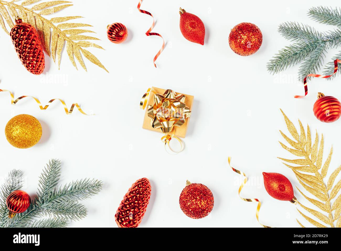 Flat lay Christmas composition with gift box, fir tree branches, red ...