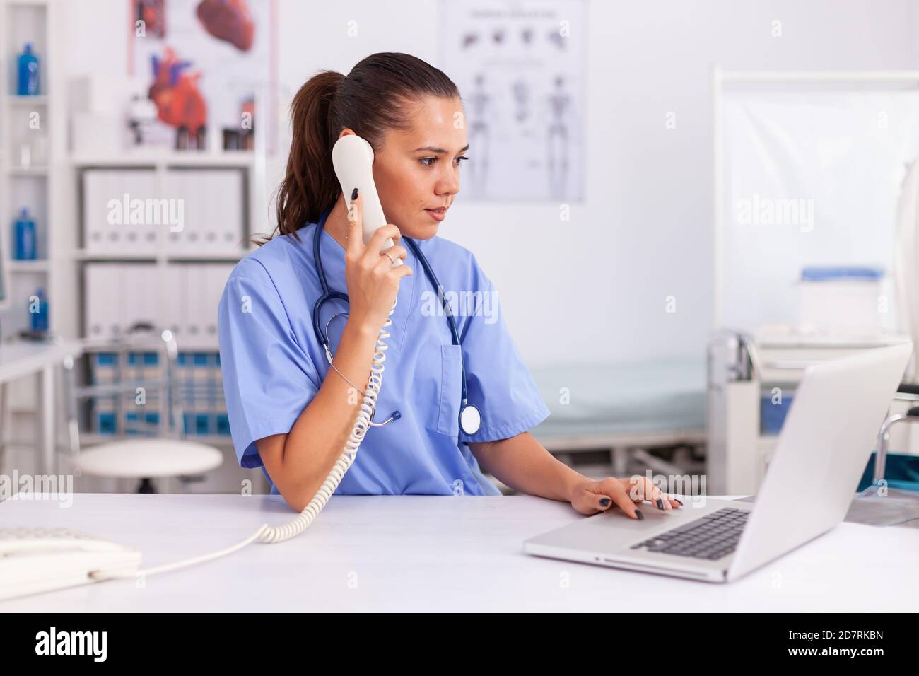 Physician nurse answering patient call hi-res stock photography and ...