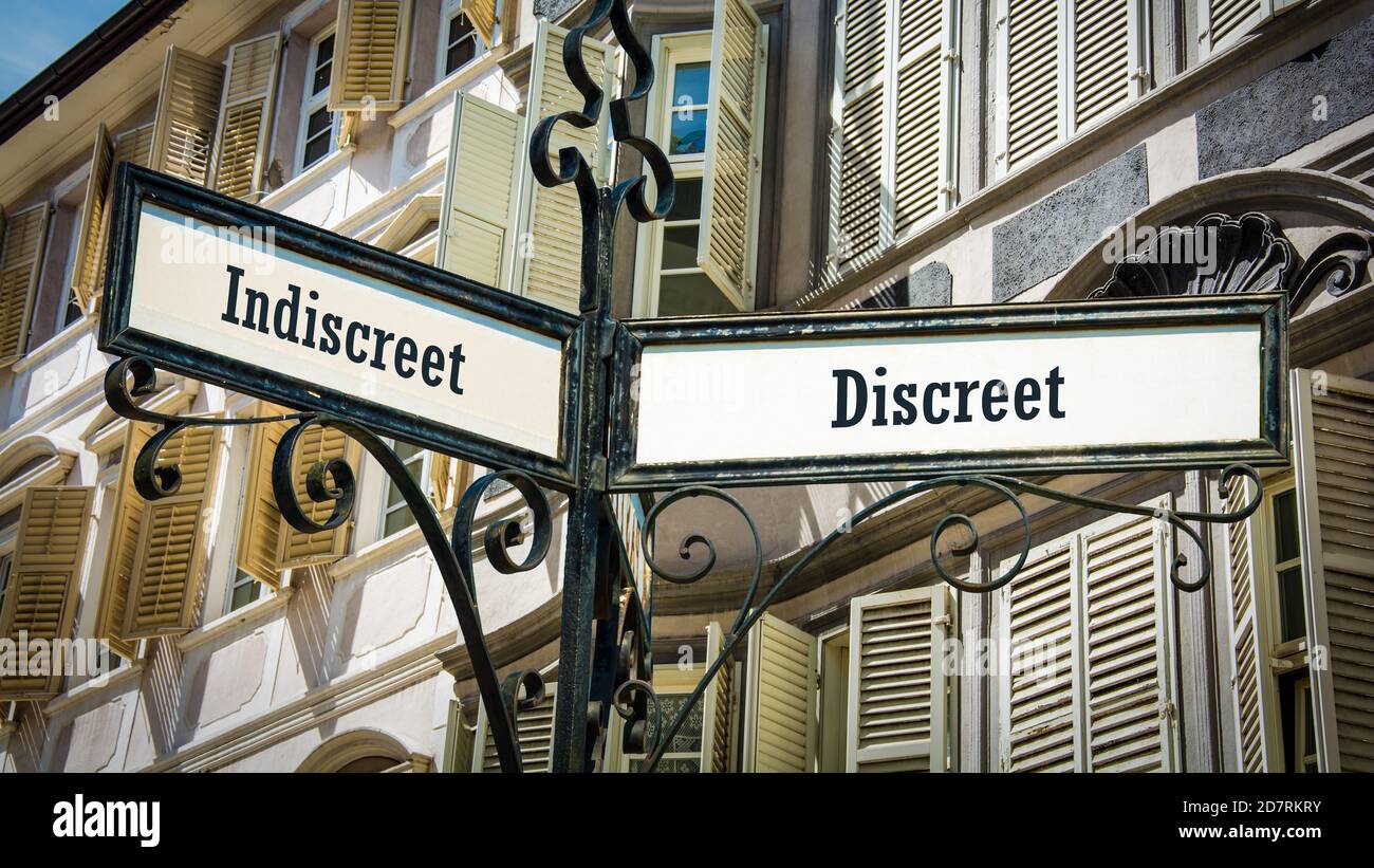 Street Sign the Direction Way to Discreet versus Indiscreet Stock Photo ...