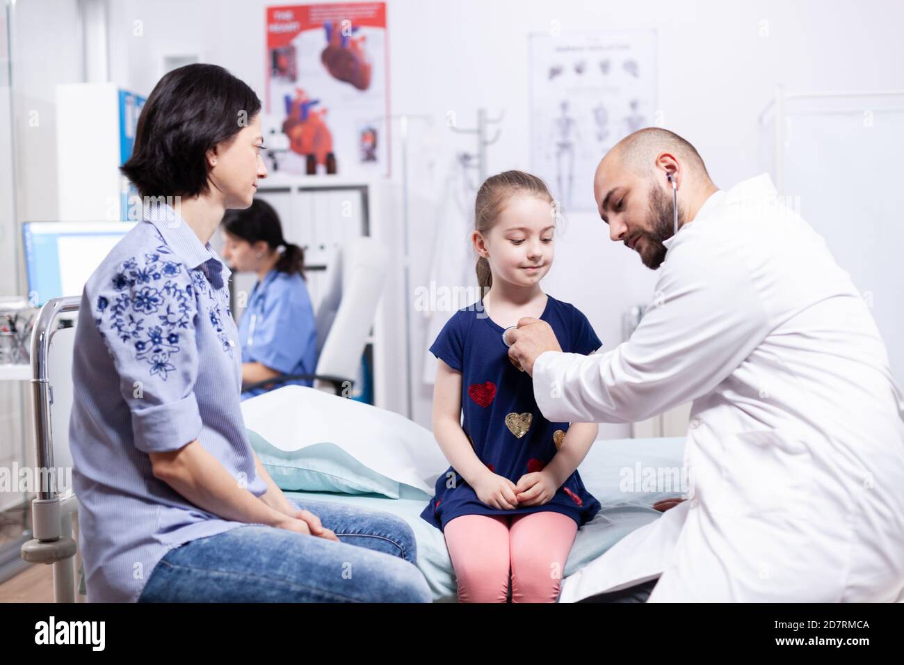 Mother came at doctor to check child general health in hospital office ...