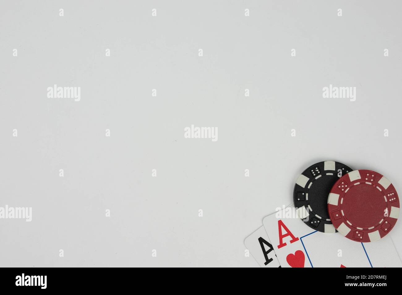 White background and the poker chips and playing cards on the corner ...