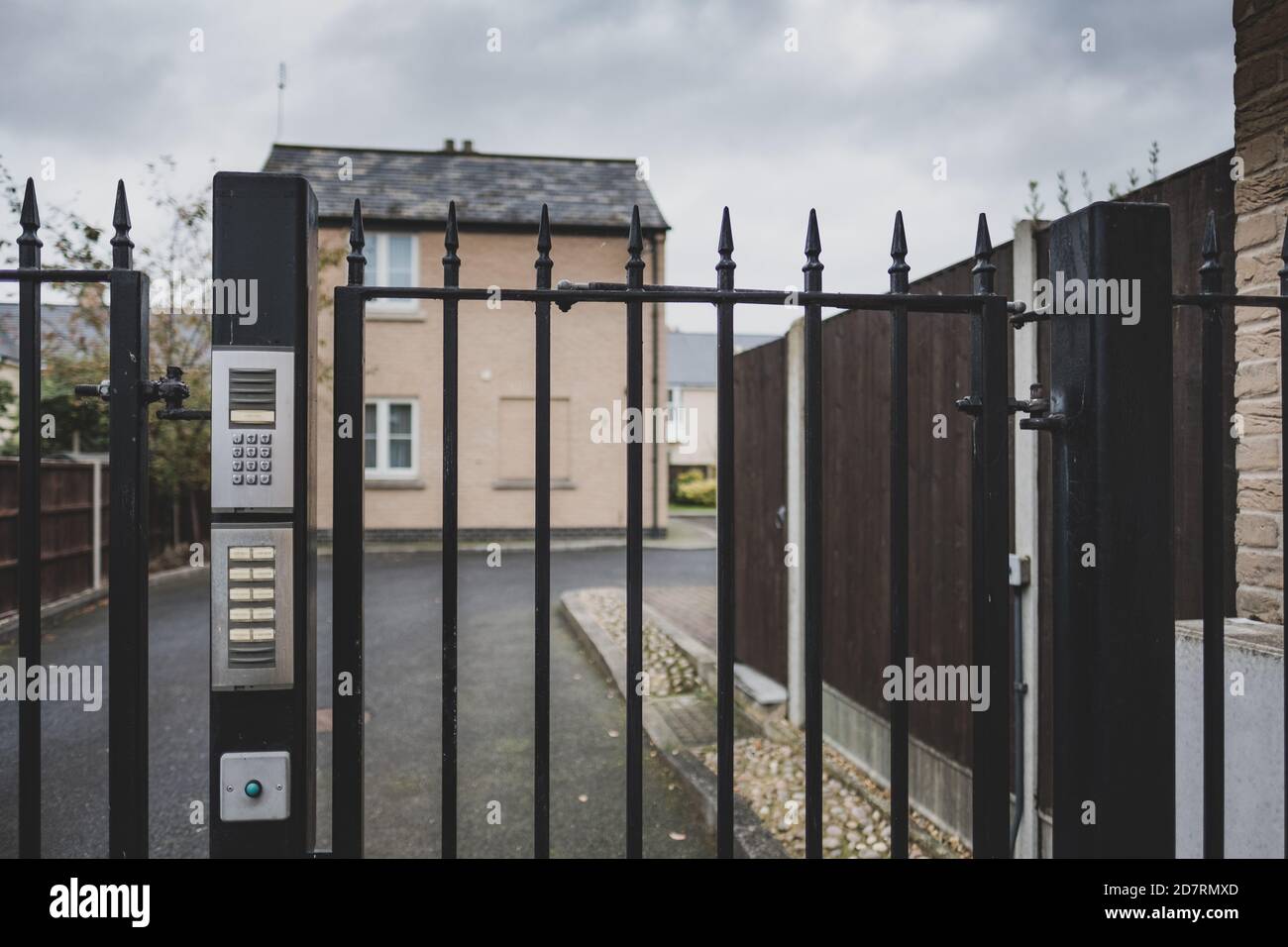 Shallow focus of an electronic keypad seen at the gated entrance to a ...