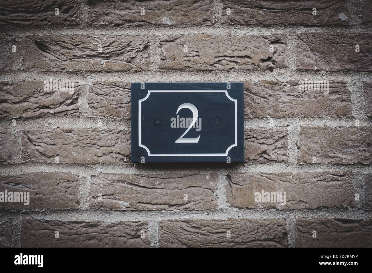Isolated view of a newly installed, slate Number 2 sign seen outside a ...