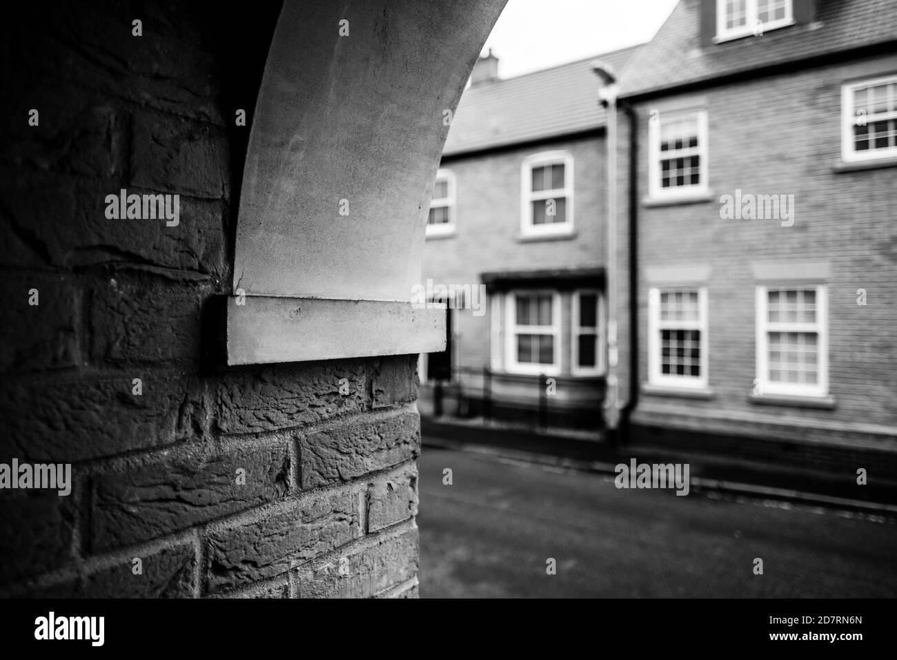Shallow focus of a stonework arch seen looking out to an empty ...
