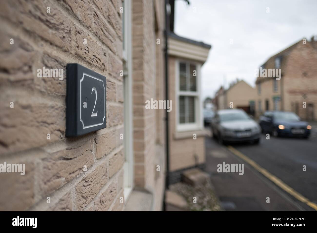 Shallow focus of generic town house number signs seen attached the to ...