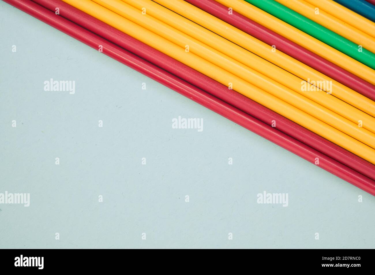 High angle shot of colorful crayons on a blue surface Stock Photo - Alamy
