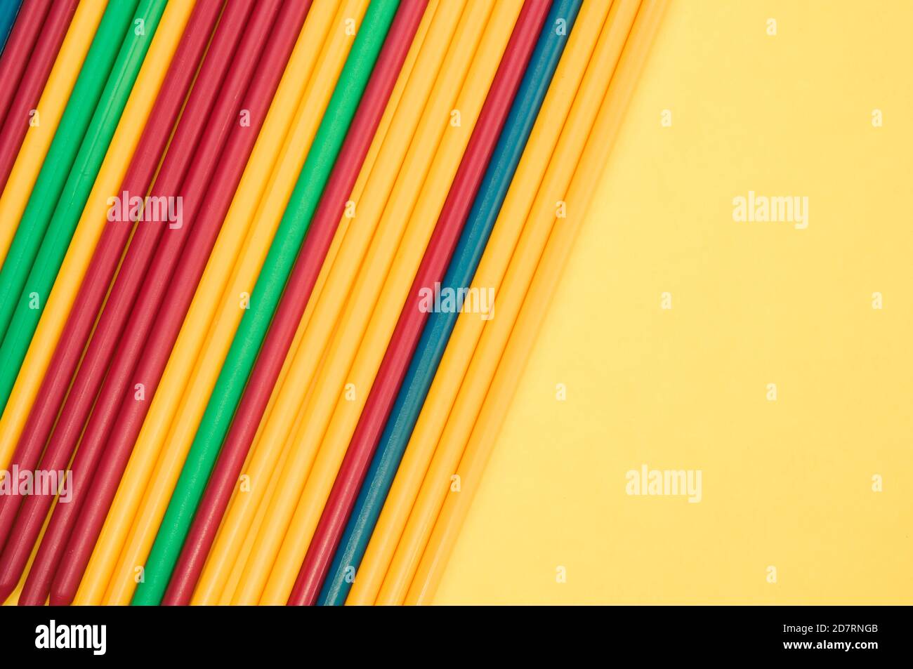 High angle shot of colorful crayons on a yellow surface Stock Photo - Alamy