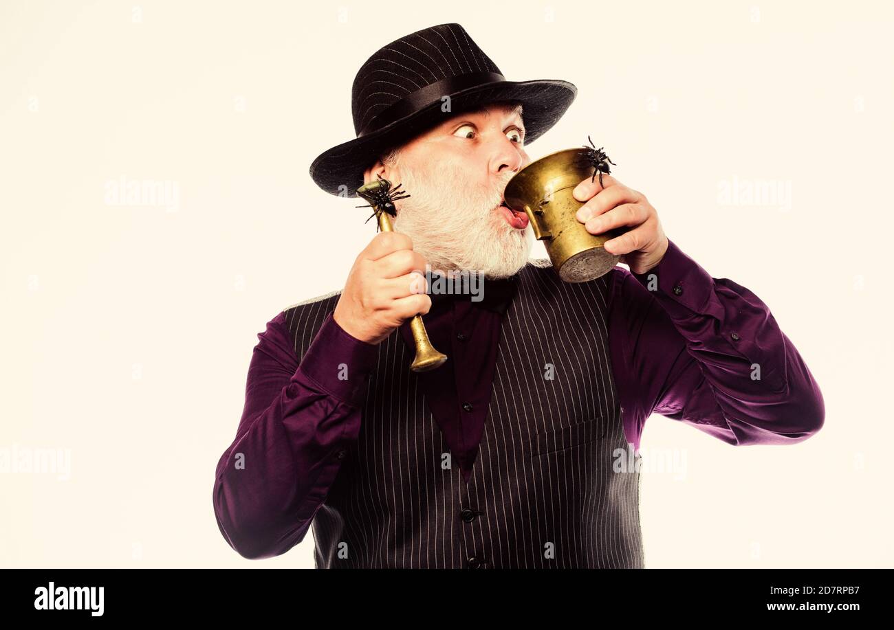 Halloween concept. Strange people. Preparing magic Halloween drink ...