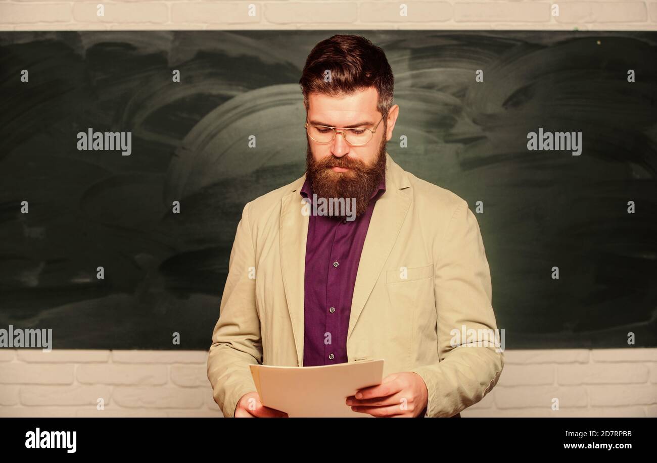 Prepare for lesson. Teacher strict serious bearded man chalkboard ...