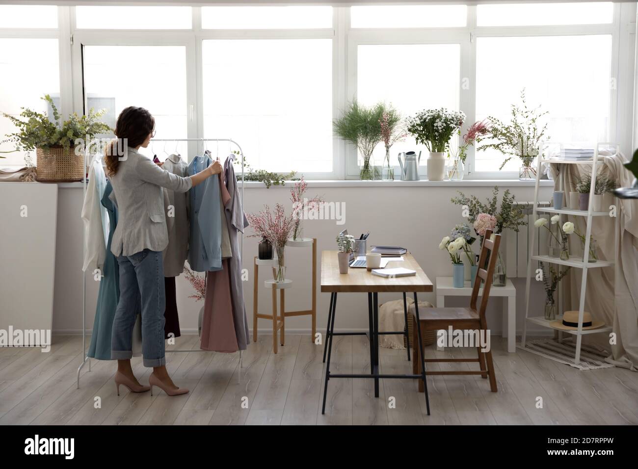 Female designer prepare new clothing collection in atelier Stock Photo ...