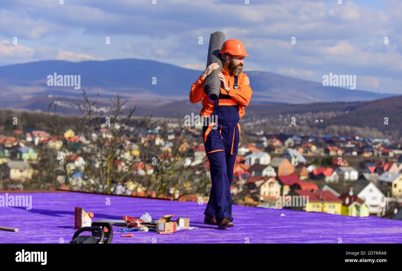 roof industrial. Roofer contractor laying rooftop with protective ...