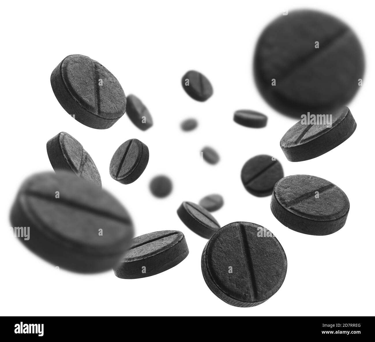 Black activated carbon tablets levitate on a white background Stock ...