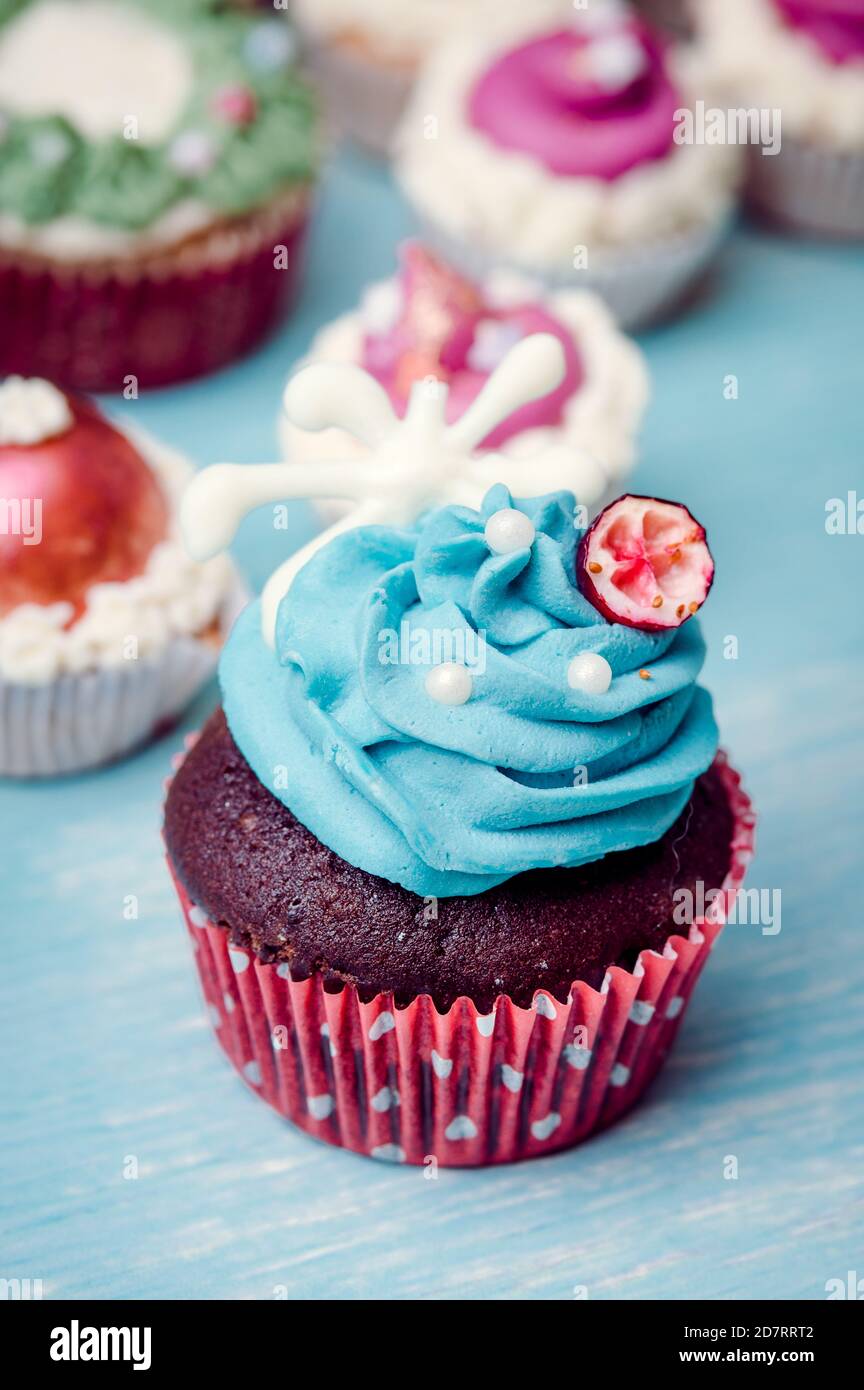 Vertical shot of deliciously decorated cupcakes Stock Photo - Alamy