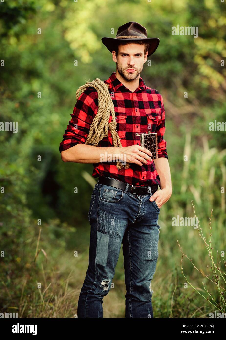 confident horsemen. man in hat drink whiskey. western cowboy outdoor ...