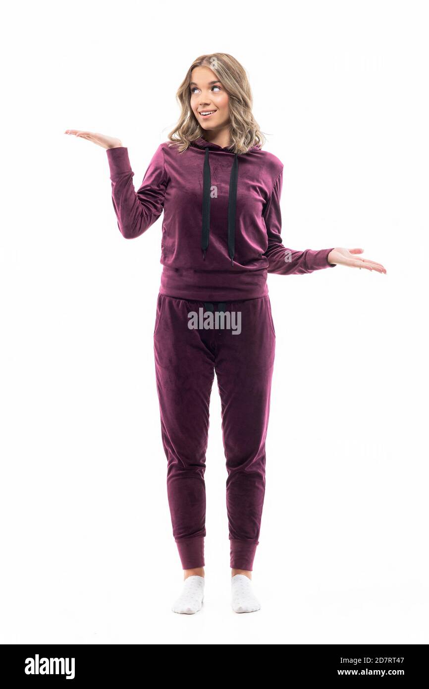 Cute hesitant casual girl having decision or choice with open hands ...