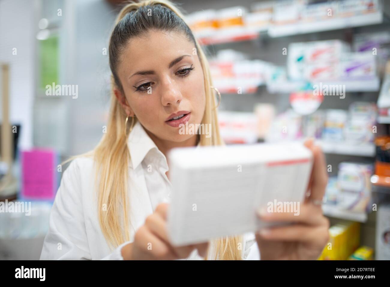 Chemist checking drugs shelf hi-res stock photography and images - Alamy