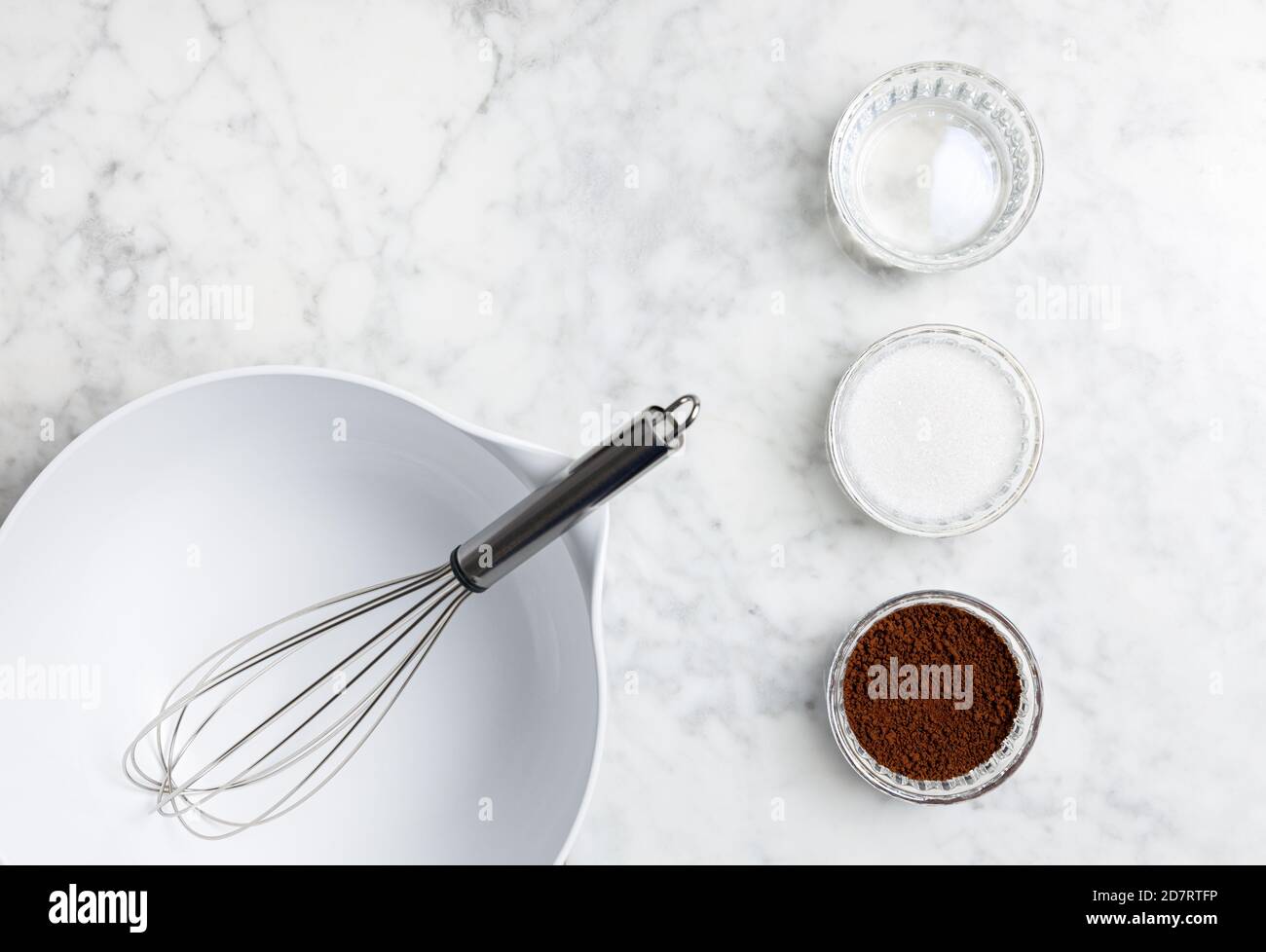 Dalgona coffee ingredients on a marble table: Instant coffee, sugar and ...