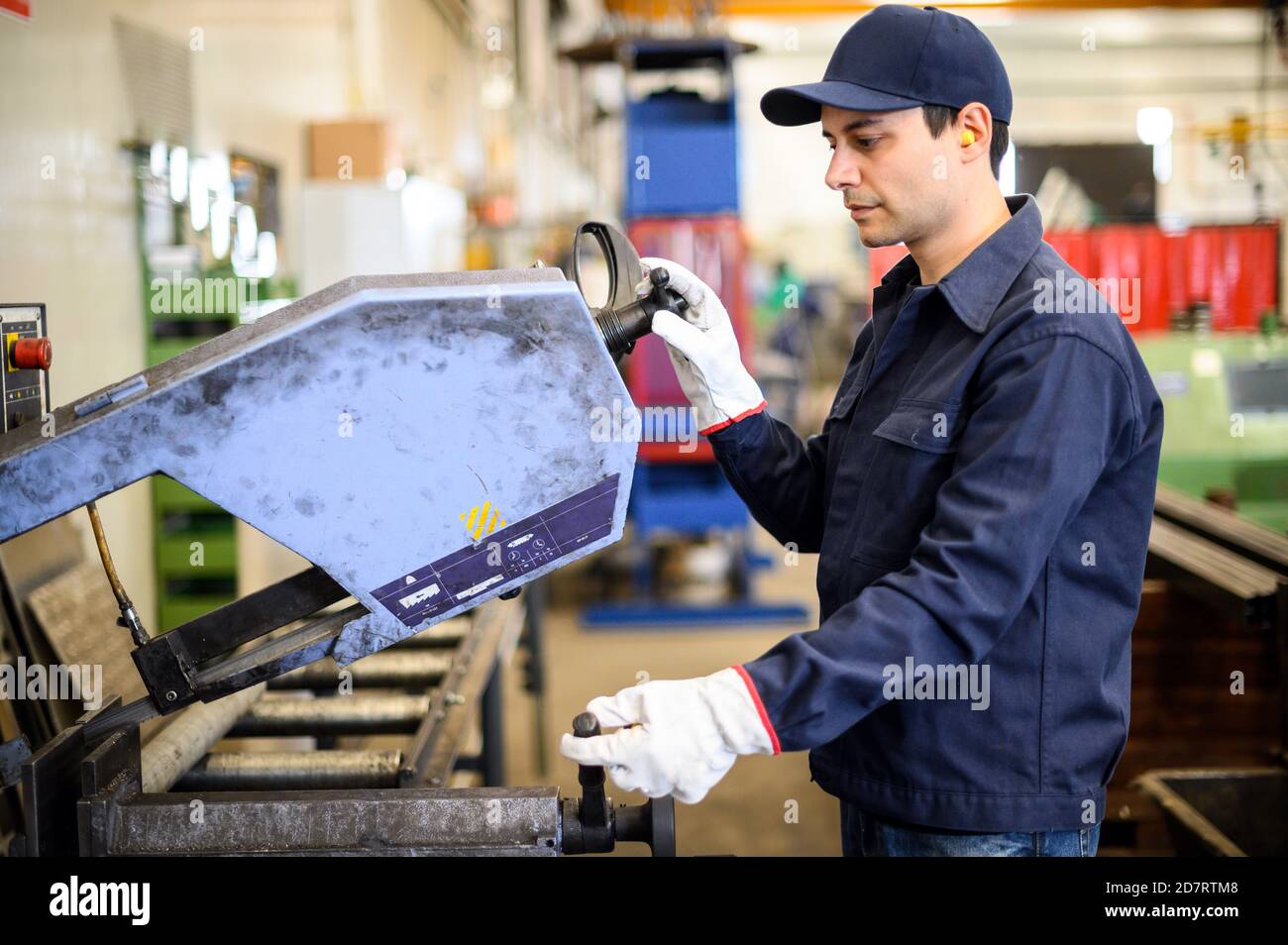 Worker near milling machine at factory Stock Photo - Alamy
