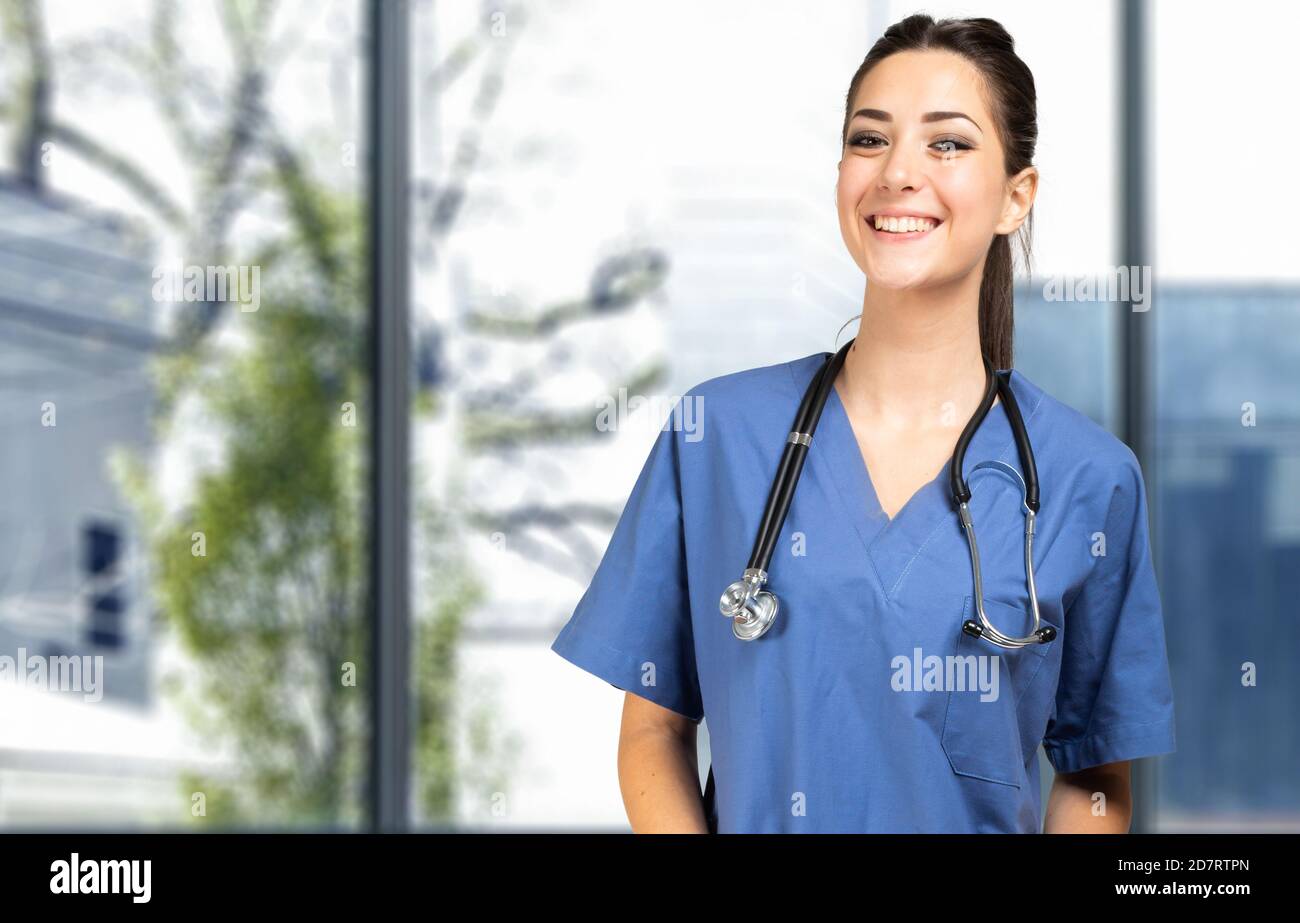 Nurse portrait smiling in a bright clinic hall Stock Photo - Alamy