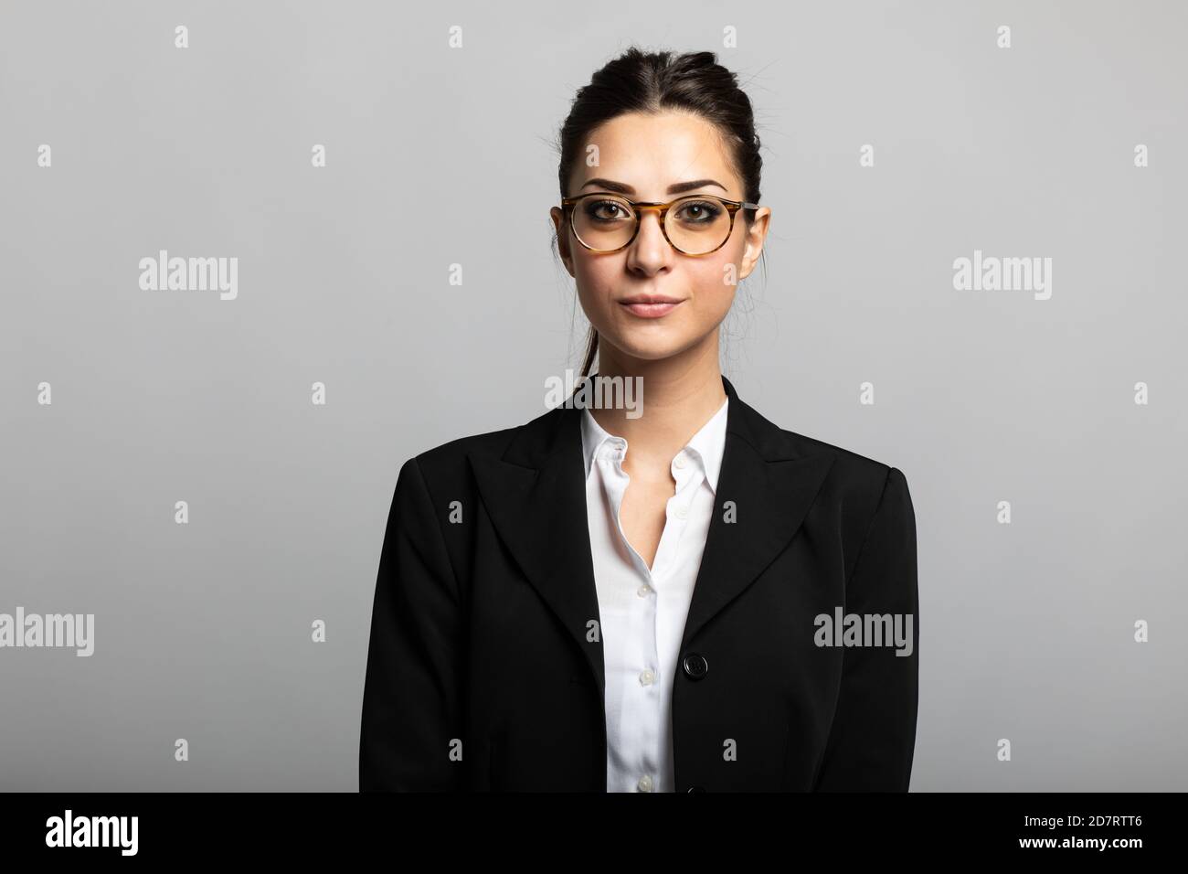 Confident female executive wearing eyeglasses hi-res stock photography ...