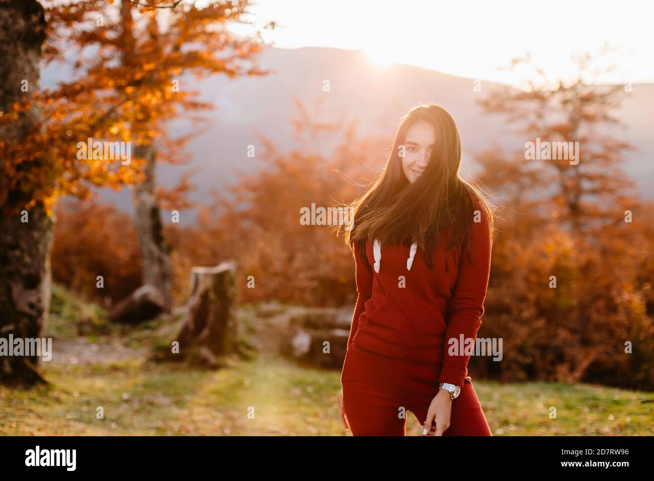 Portrait of woman in autumn forest at sunset Stock Photo - Alamy
