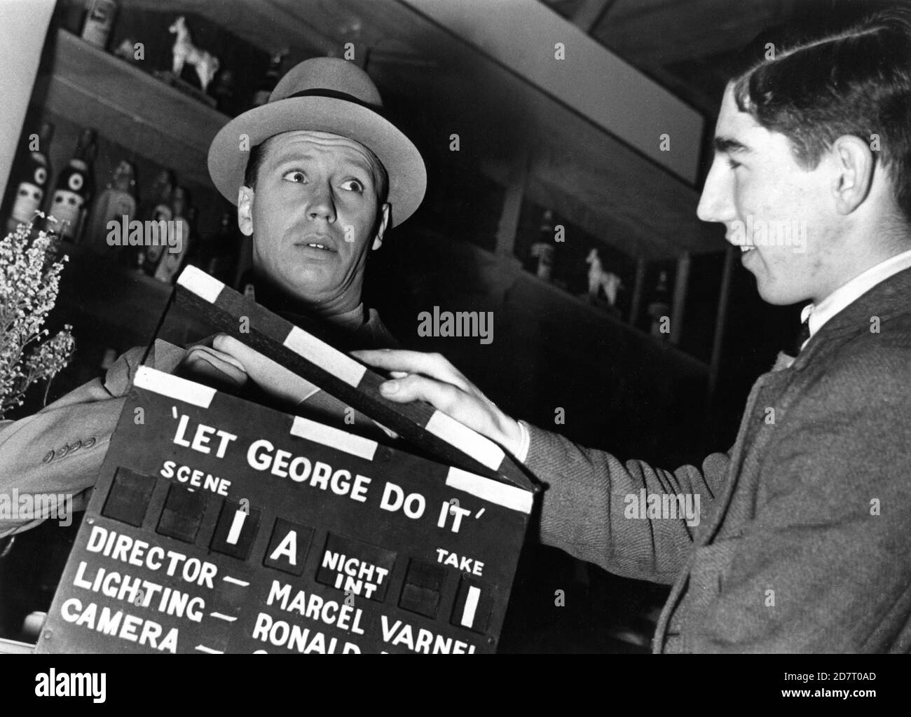 GEORGE FORMBY om set candid with Clapper Boy holding Clapperboard ...