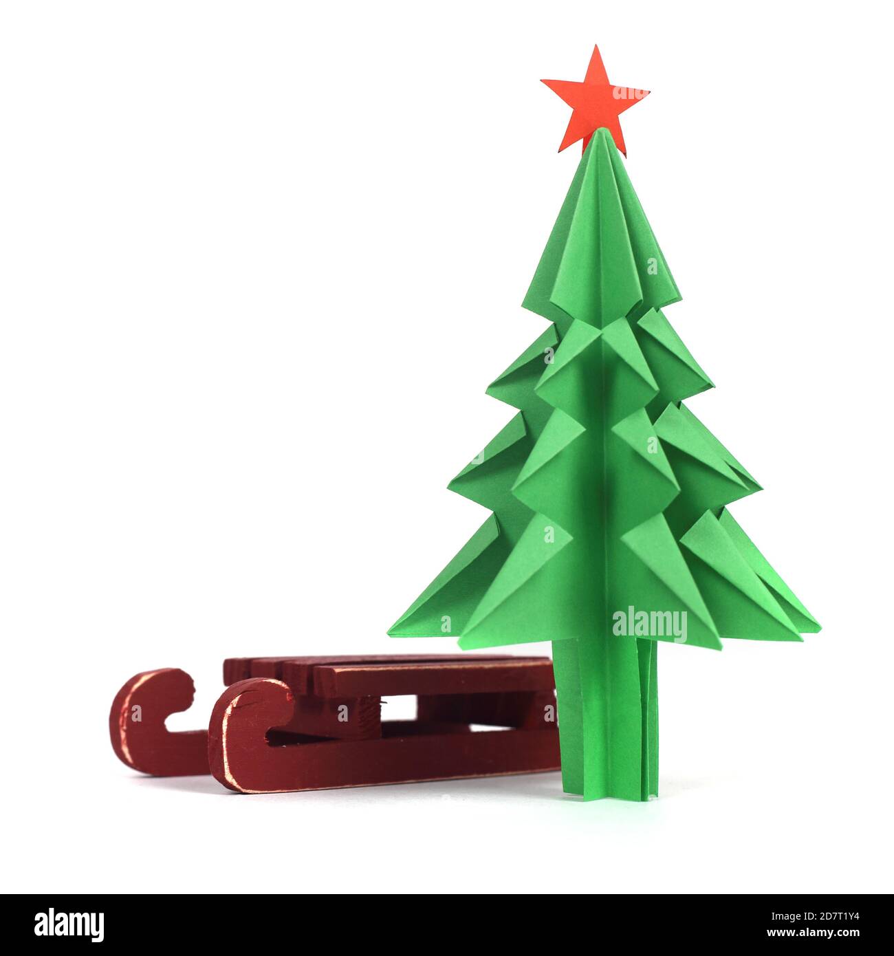 Origami Christmas tree of green craft paper isolated on white ...