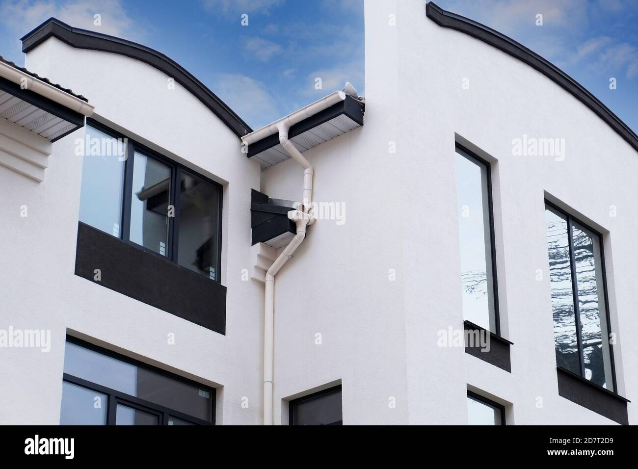 Newly installed construction of rain gutter system on the roof of frame ...